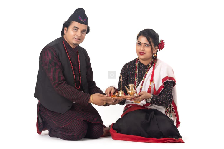 A beautiful Newari couple holding a Puja thali together - Photos Nepal