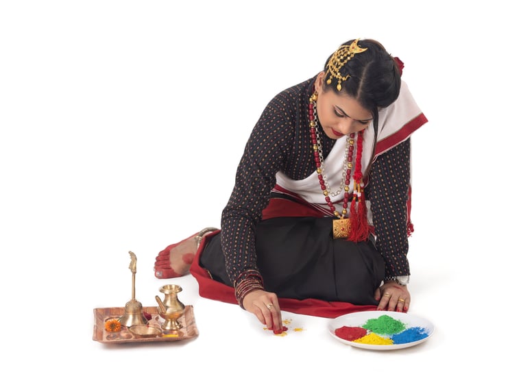A beautiful Newari Woman making Rangoli - Photos Nepal