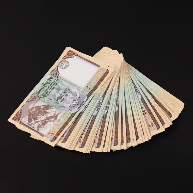 A bundle of banknotes of Rupees 10 in a spread - Photos Nepal