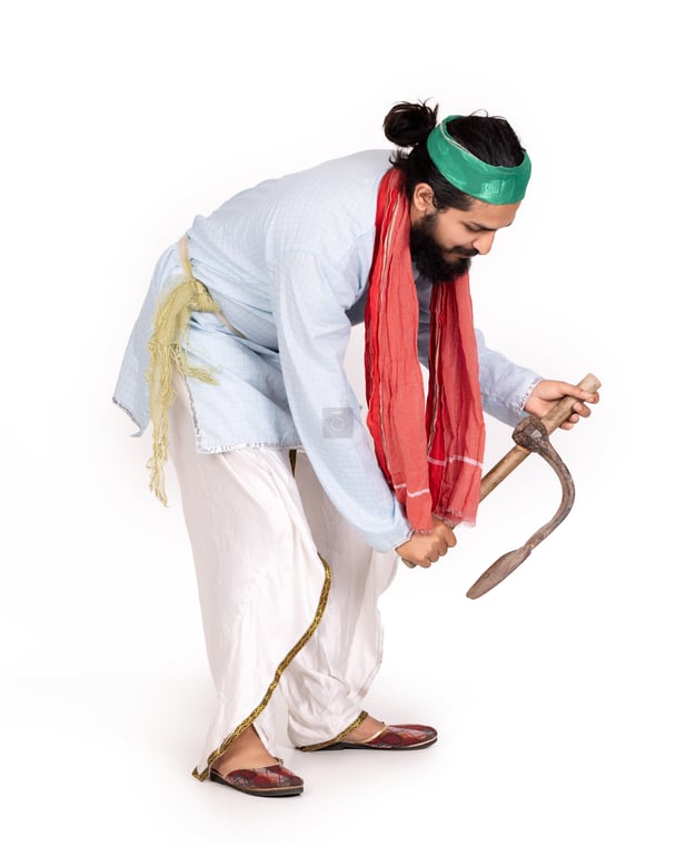 A handsome guy in Dhoti Kurta holding a Kodali - Photos Nepal