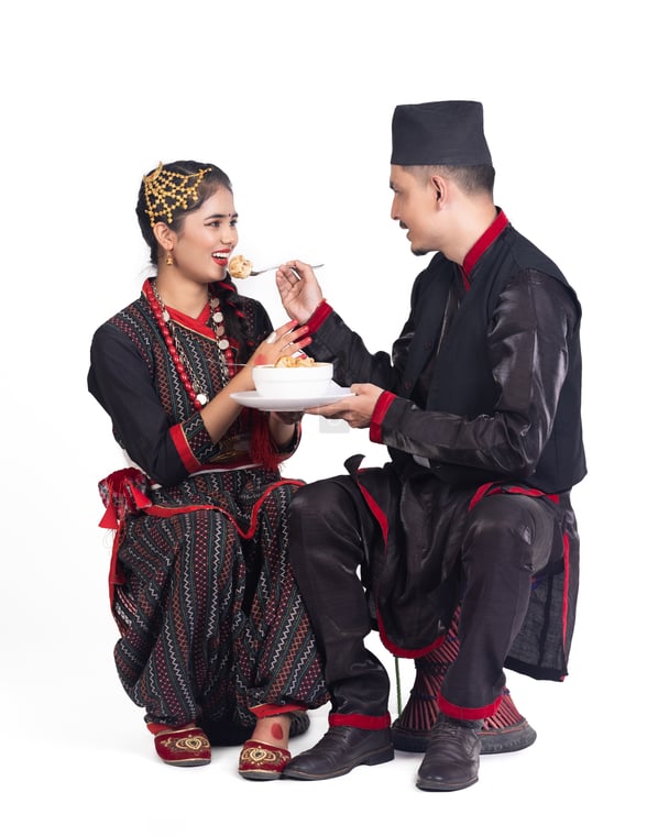 A Newari couple enjoying a bowl of momos - Photos Nepal