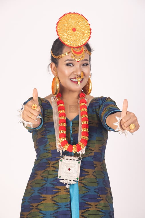 A charming Limbu girl in a traditional garb gives double thumbs up with ...