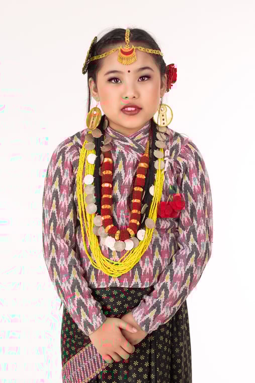 A dazzling little girl with a sweet grin poses for the camera with ...