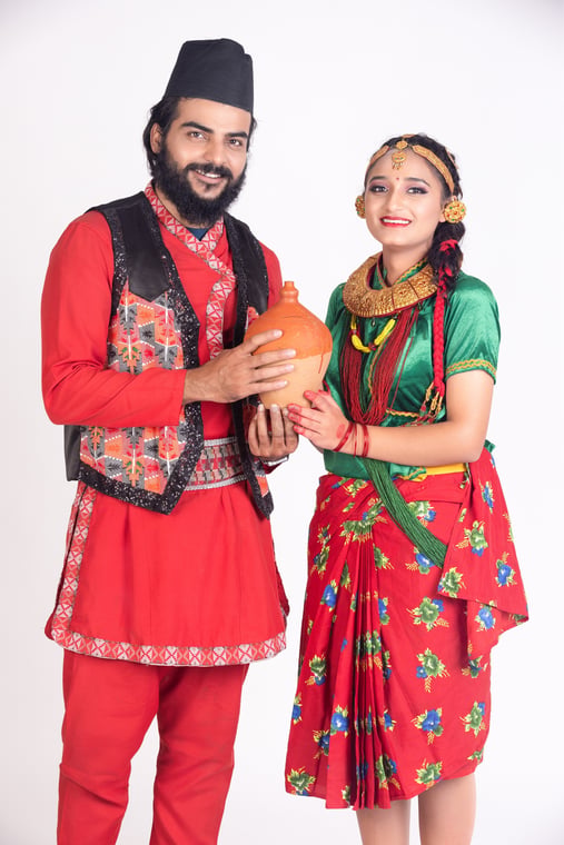A engaged and enchanted traditional pair is holding a Khutruke ...
