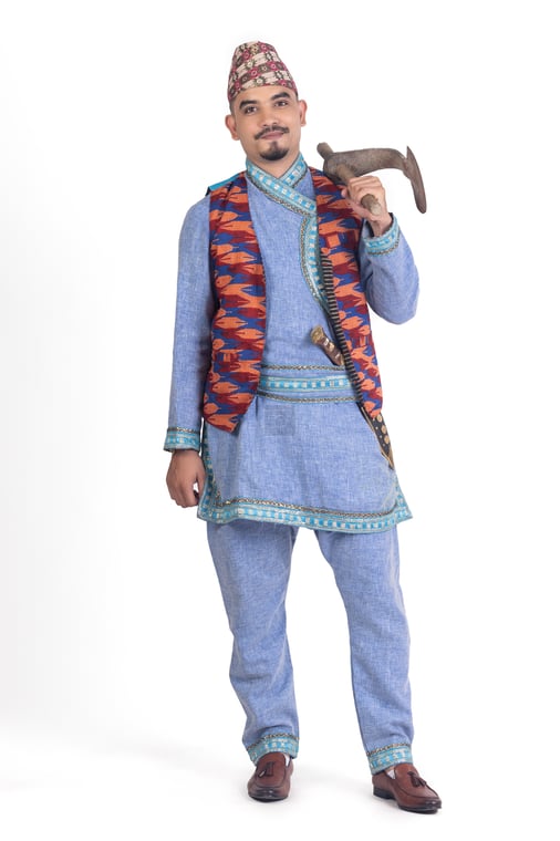 A excited young guy holding Kodalo while wearing traditional Nepali ...