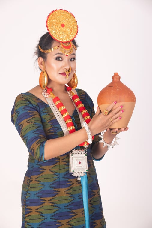 A gorgeous, young traditional Limbu girl holding her Khutruke - Photos ...