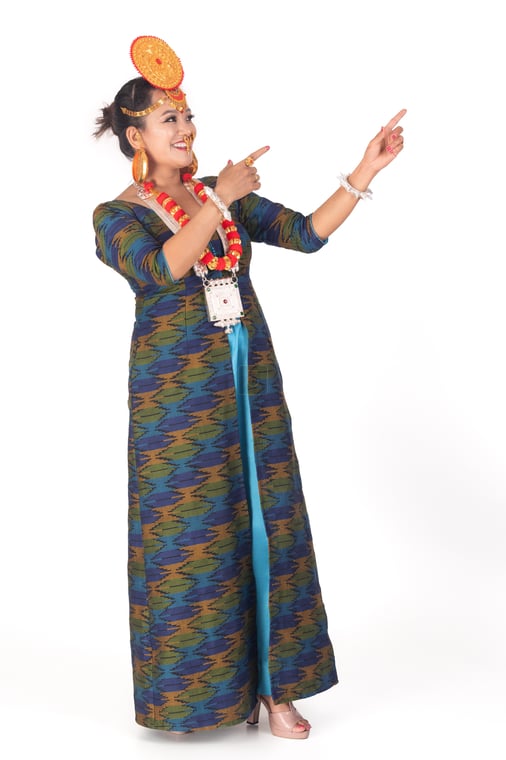 A happy stunning girl with traditional customs pointing somewhere ...