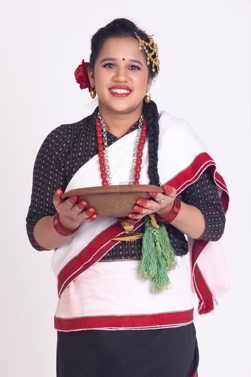 A happy woman carrying a clay matka while wearing a cultural attire ...