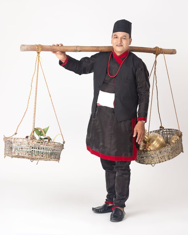A Newari dressed local man carrying Kharpan - Photos Nepal