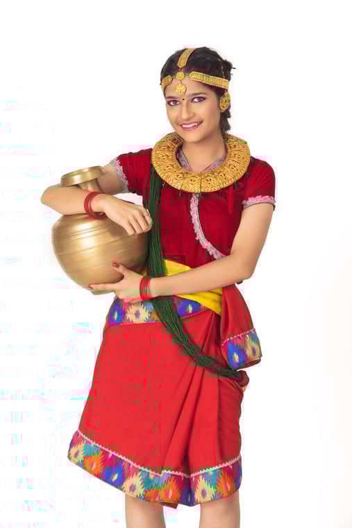 A traditional young girl carrying Gagro - Photos Nepal