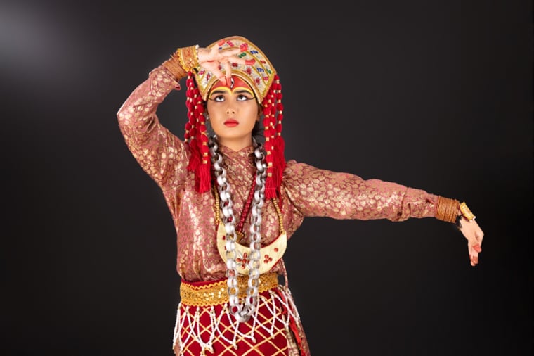 Kumari, a living goddess, looking upward while dancing. - Photos Nepal
