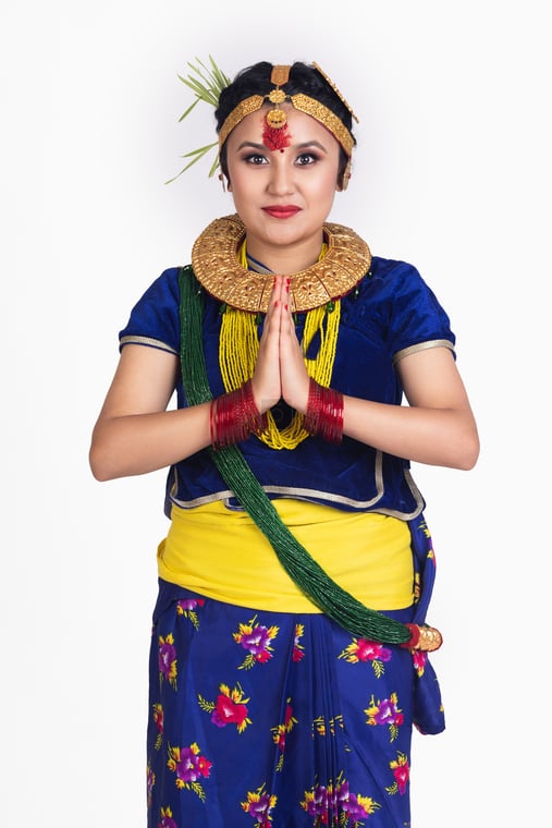 A proud and confident traditional girl offering Namaste greeting ...