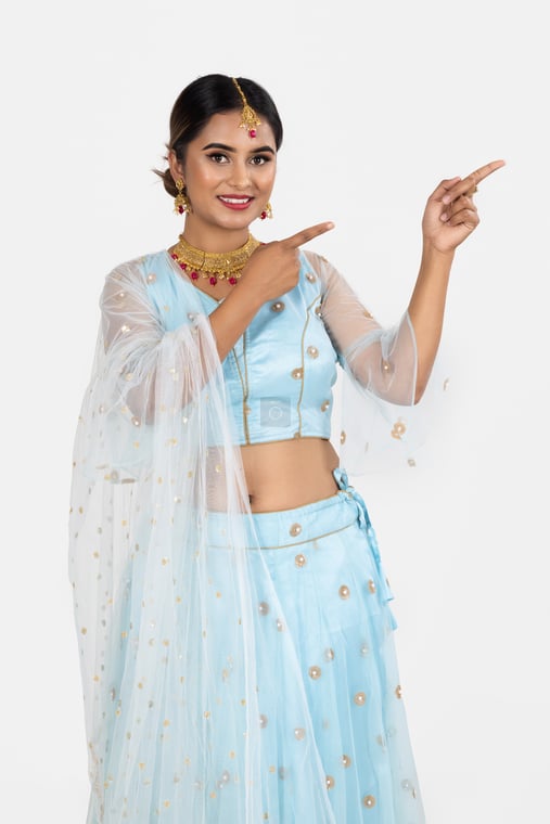 Charismatic Nepali Girl in a Light Blue Lehenga Pointing Right - Photos ...