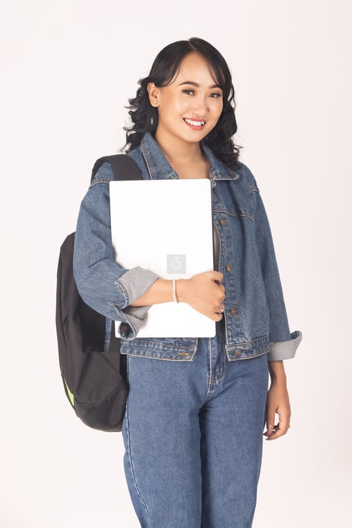 Cheerful Nepali College Student with Backpack and Laptop Poses for ...