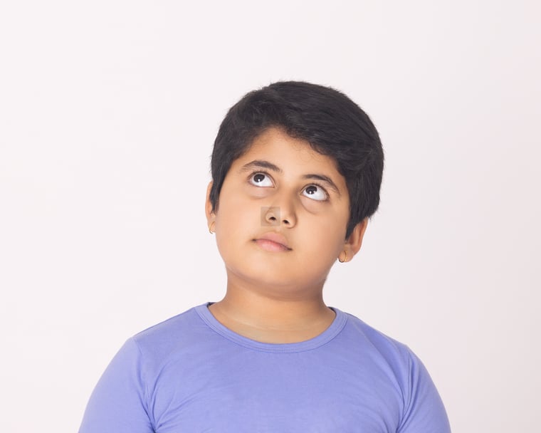 Close-up of a Child with a Round Face Looking Up - Photos Nepal