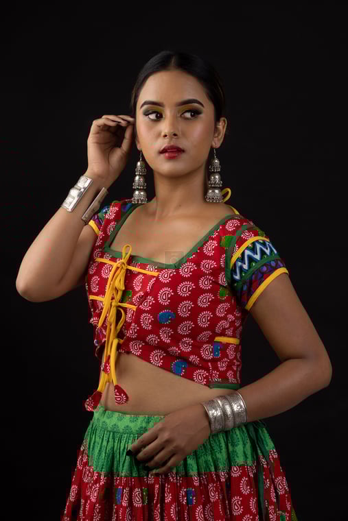 Delicate Pose of Tharu Girl in Traditional Tharu Attire - Photos Nepal