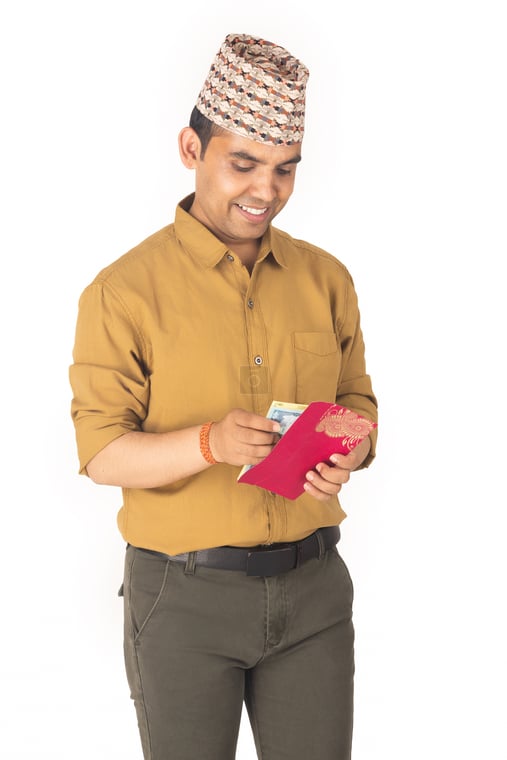 Happy Nepali Man Putting Dashain Dakshina in Envelope with Nepali Money ...
