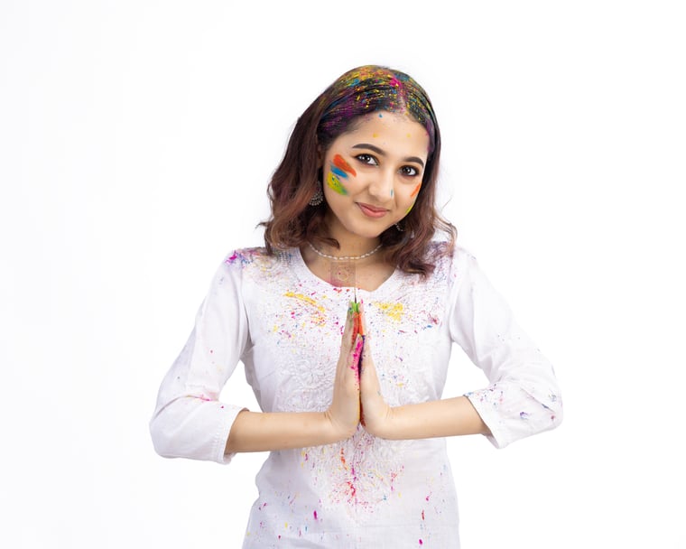Holi Festival of Colors with Namaste: Young girl with colorful face ...