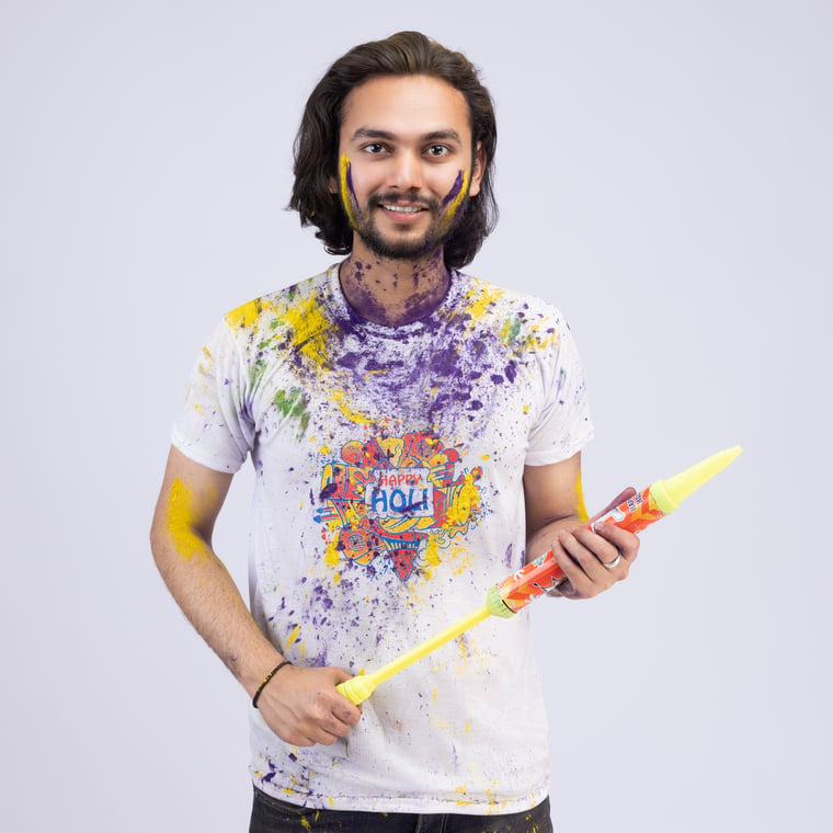 Holi Festivities with a Smiling Nepali Man and his Pichkari - Photos Nepal