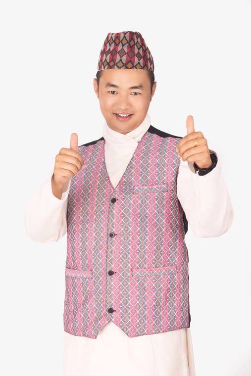 Limbu man giving double thumbs up in cultural dress - Photos Nepal
