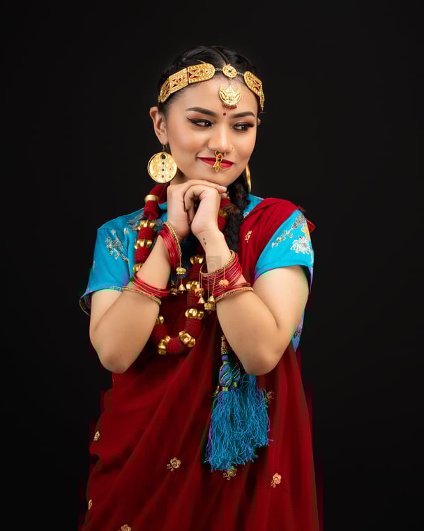 Magar girl in traditional attire looking pensive with hands on chin ...