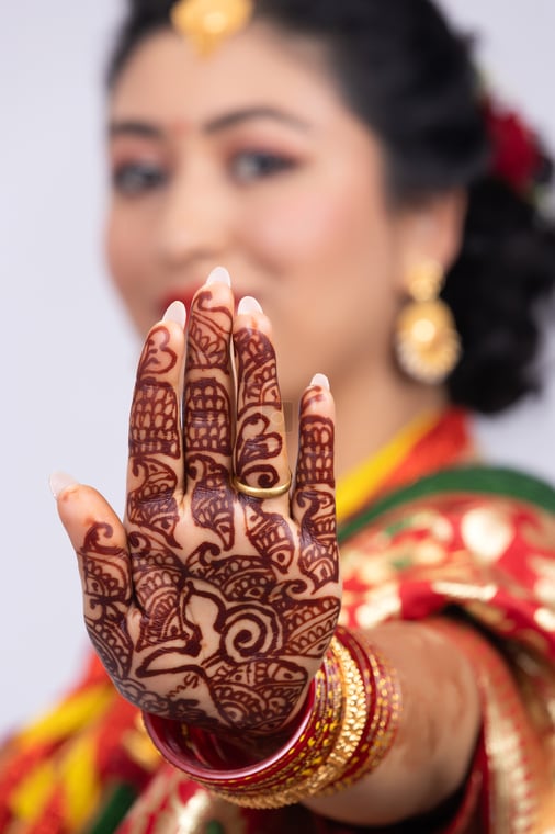 Mehendi-adorned Hand and Blurred Background - Photos Nepal