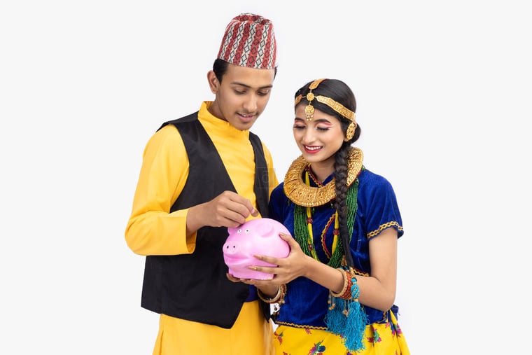 Nepali Couple Deposits Money With Smiles In Traditional Nepali Dress 9332