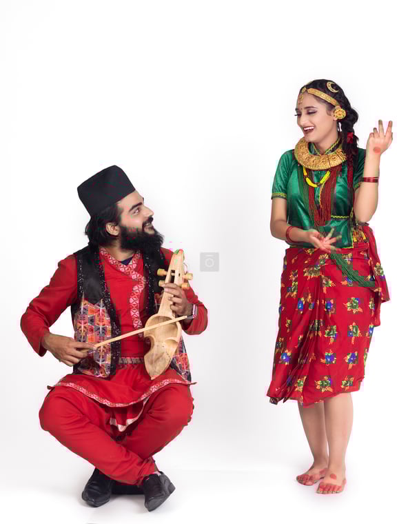 Nepali girl dancing while man plays sarangi sitting on muda - Photos Nepal