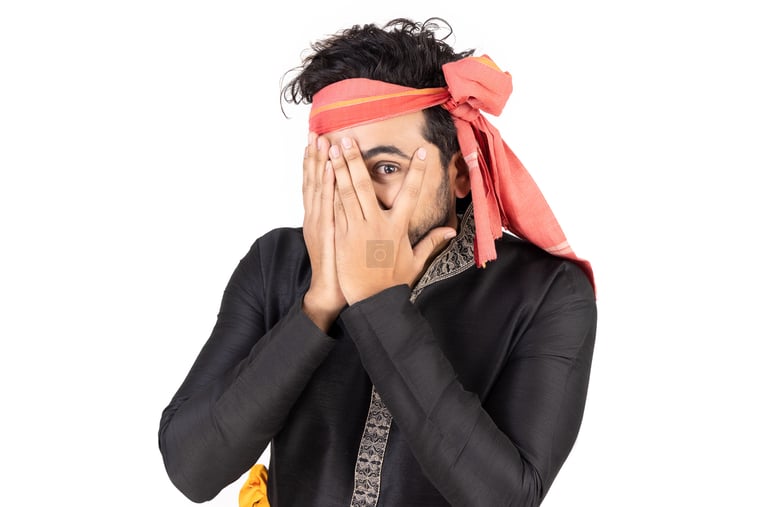 Nepali Madhesi man in traditional dress and a secretive expression ...