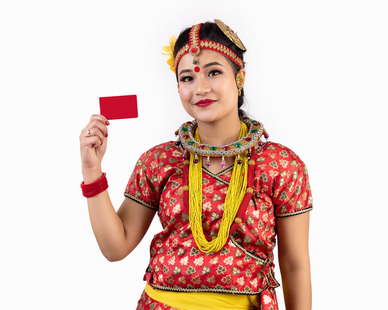 Nepali woman with a cheerful expression holding a credit card for ...