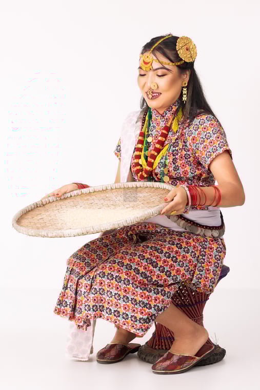 Rai woman sitting in muda with Rice on Nanglo - Photos Nepal