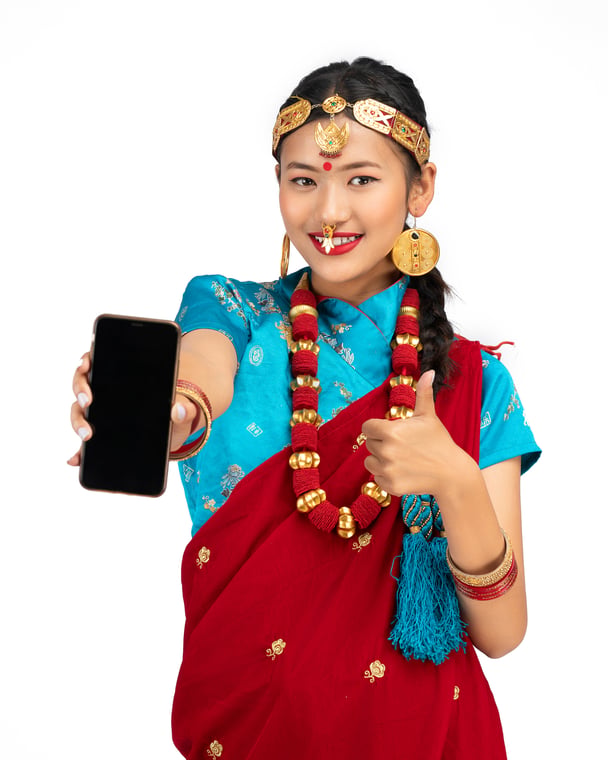 Smiling Magar Girl Showing Mobile Screen with Thumbs Up - Photos Nepal