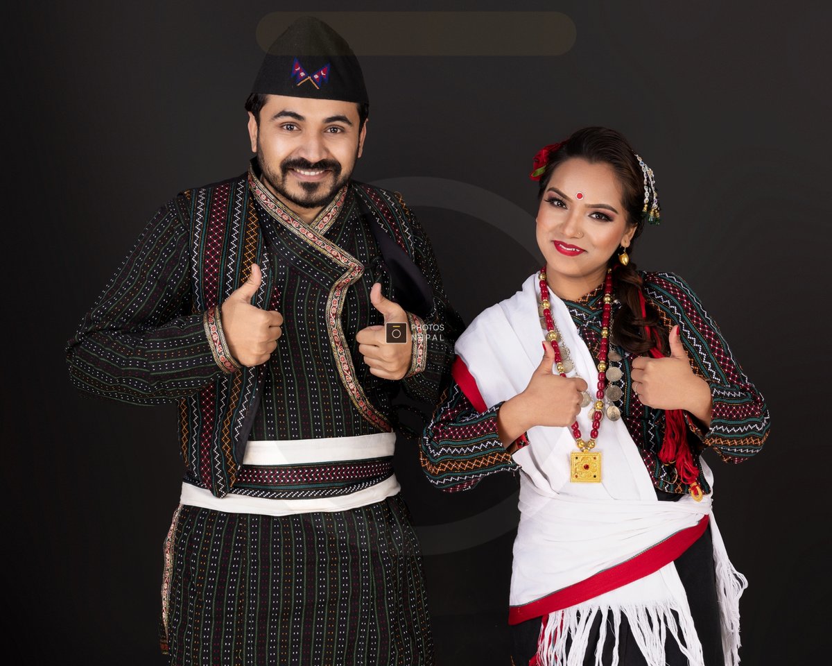 Smiling Newari Couple Showing Approval In Newari Cultural Dress