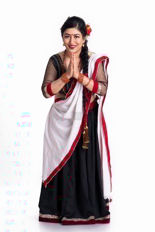 Smiling Newari Girl Bowing in Namaste Greeting - Photos Nepal