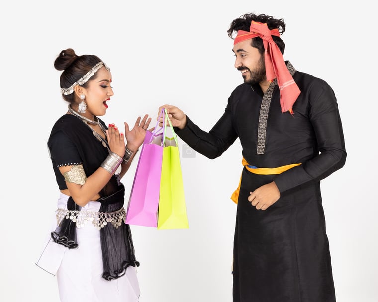 Tharu Couple in Traditional Attire with Shopping Bags: Authentic Nepali ...