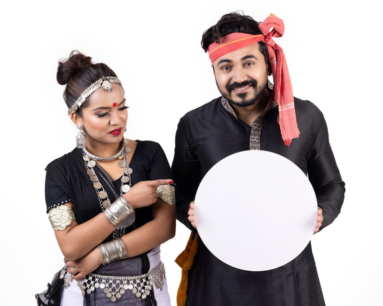 Tharu Couple in Traditional Dress with Circular Playcard - Photos Nepal