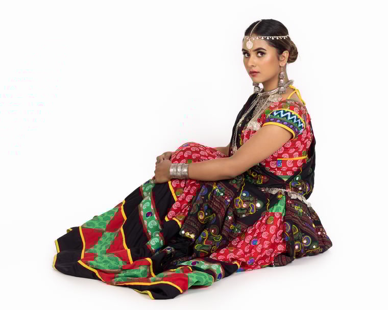 Tharu Elegance: Sitting Portrait in Traditional Dress - Photos Nepal