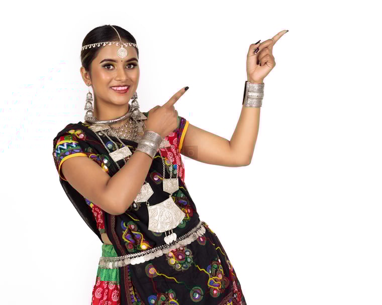 Tharu Girl in Traditional Dress Pointing Right - Photos Nepal