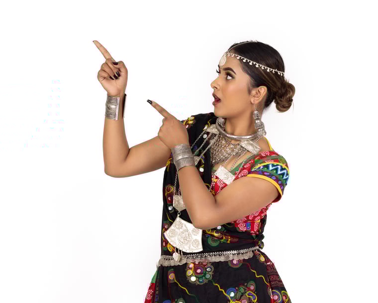 Tharu Girl in Traditional Dress Pointing Right - Photos Nepal
