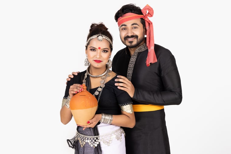 Young Nepali Tharu Couple Showcasing Khutruke and Saving Concept - Photos Nepal