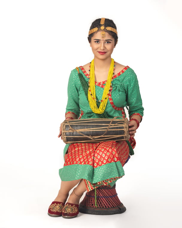A beautiful girl playing Madal - Photos Nepal