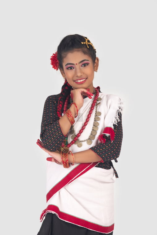 A Newari Girl in Hakupatasi posing for camera with a smile - Photos Nepal