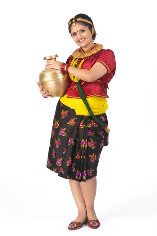 A traditionally dressed Nepalese woman carrying a water pot - Photos Nepal