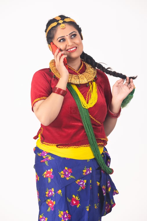 Girl talking on mobile phone wearing Nepali Bahun Dress - Photos Nepal
