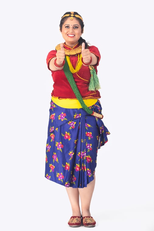 Traditionally dressed Nepali woman giving thumbs up - Photos Nepal