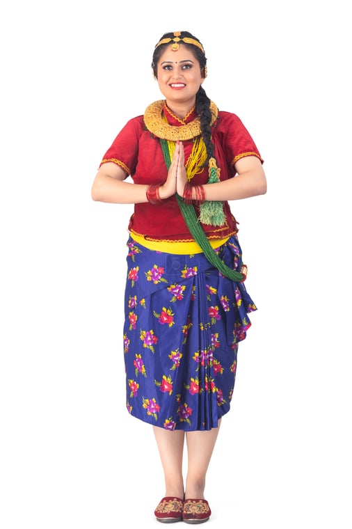 Traditionally dressed Nepali woman greeting with a Namaste - Photos Nepal