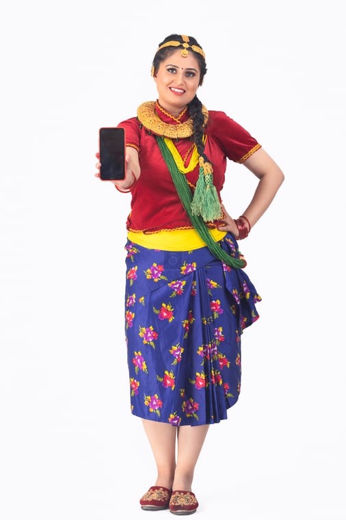 Traditionally dressed Nepali woman showing her phone - Photos Nepal
