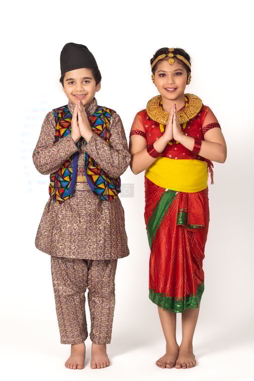 A boy and girl doing Namaste - Photos Nepal