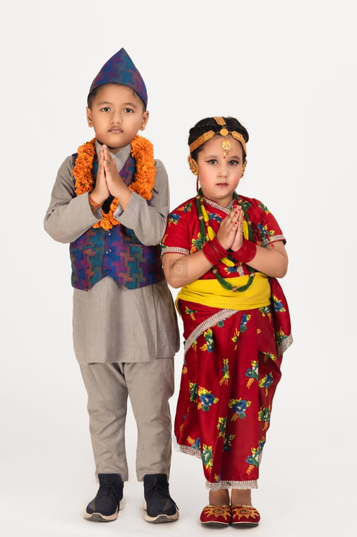 A little guy and girl doing namaste - Photos Nepal