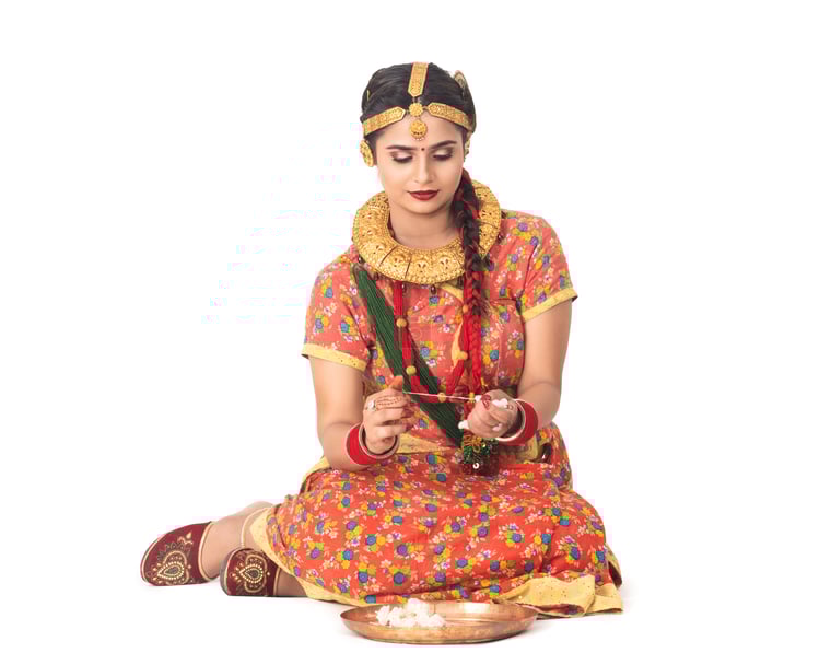 Girl making bati in Nepali dress - Photos Nepal